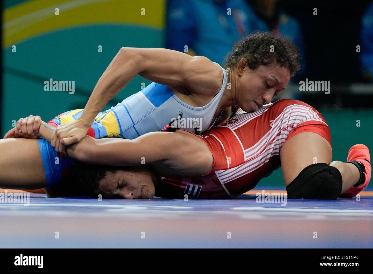 Cuba's Yusneylis Guzman, bottom, and Ecuador's Jacqueline Mollocana ...