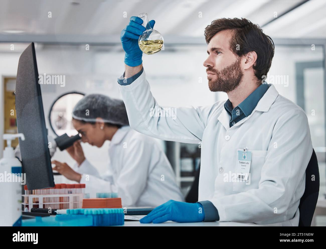 Science, man or scientist in laboratory with chemical liquid after ...