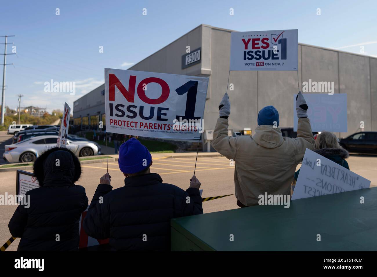 People gather in the parking lot of the Hamilton County Board of ...