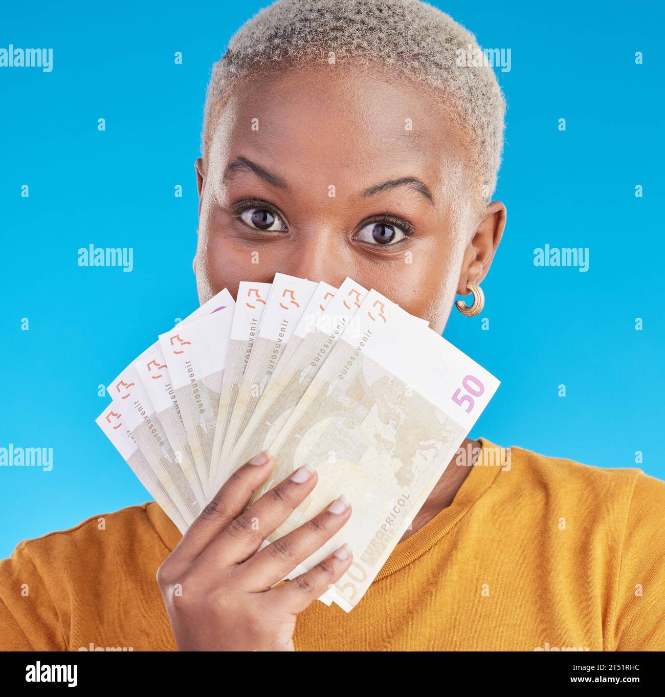 Cash, winner and woman cover face on blue, studio background for ...