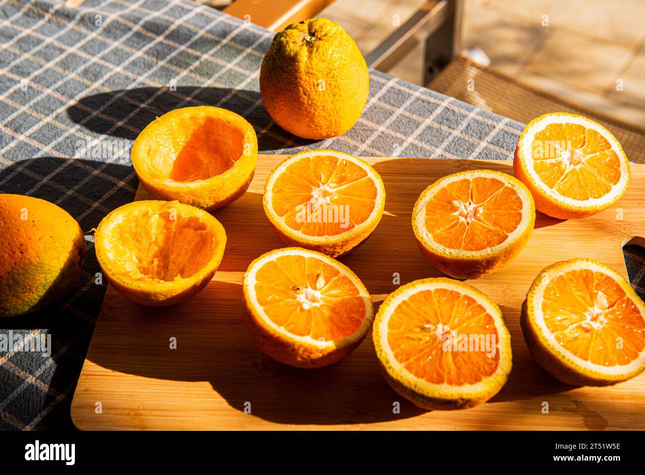 Large greek oranges, halved and ready to be squeezed for some golden ...