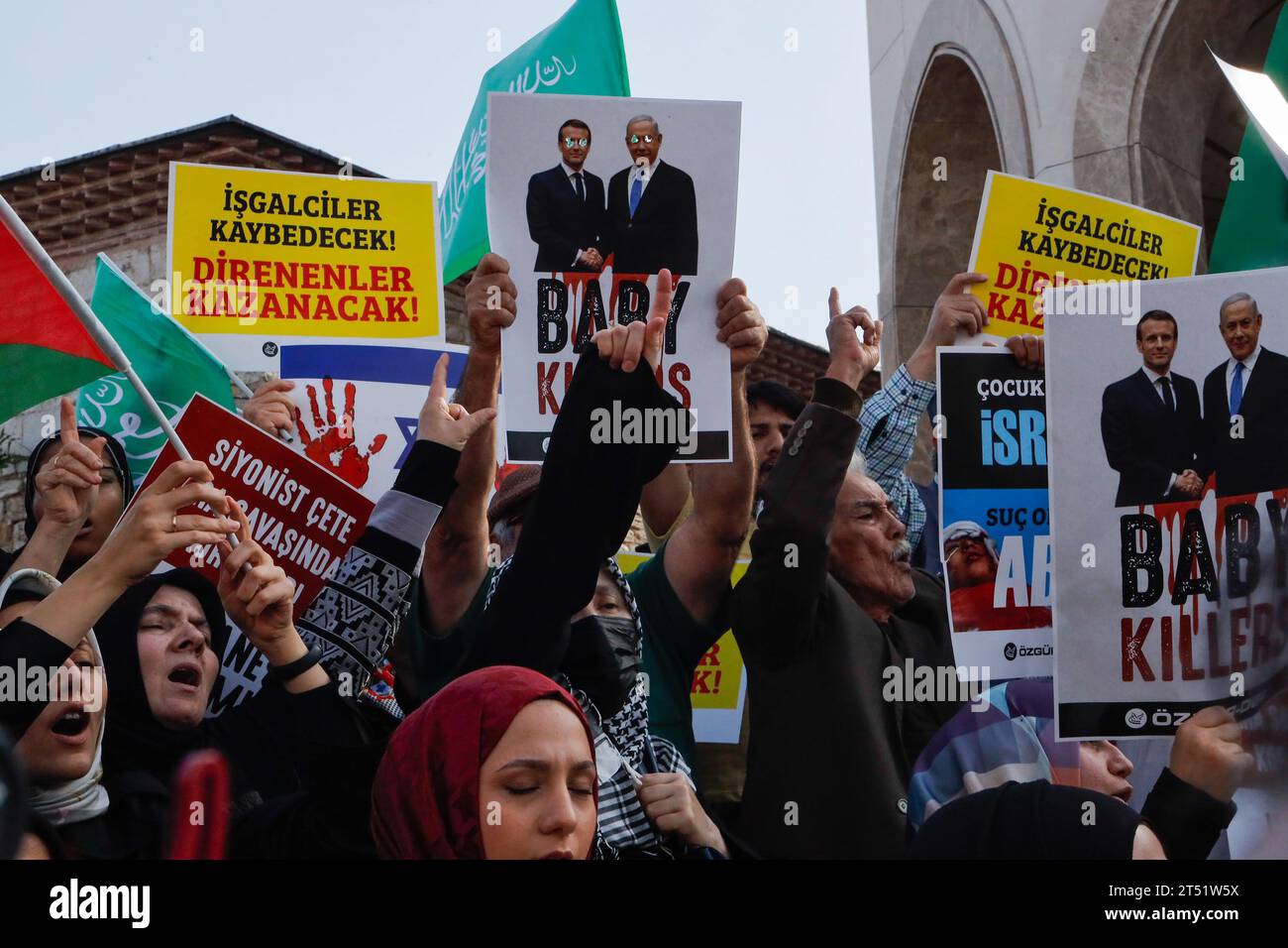 Istanbul, Turkey. 27th Oct, 2023. Protesters hold placards expressing ...