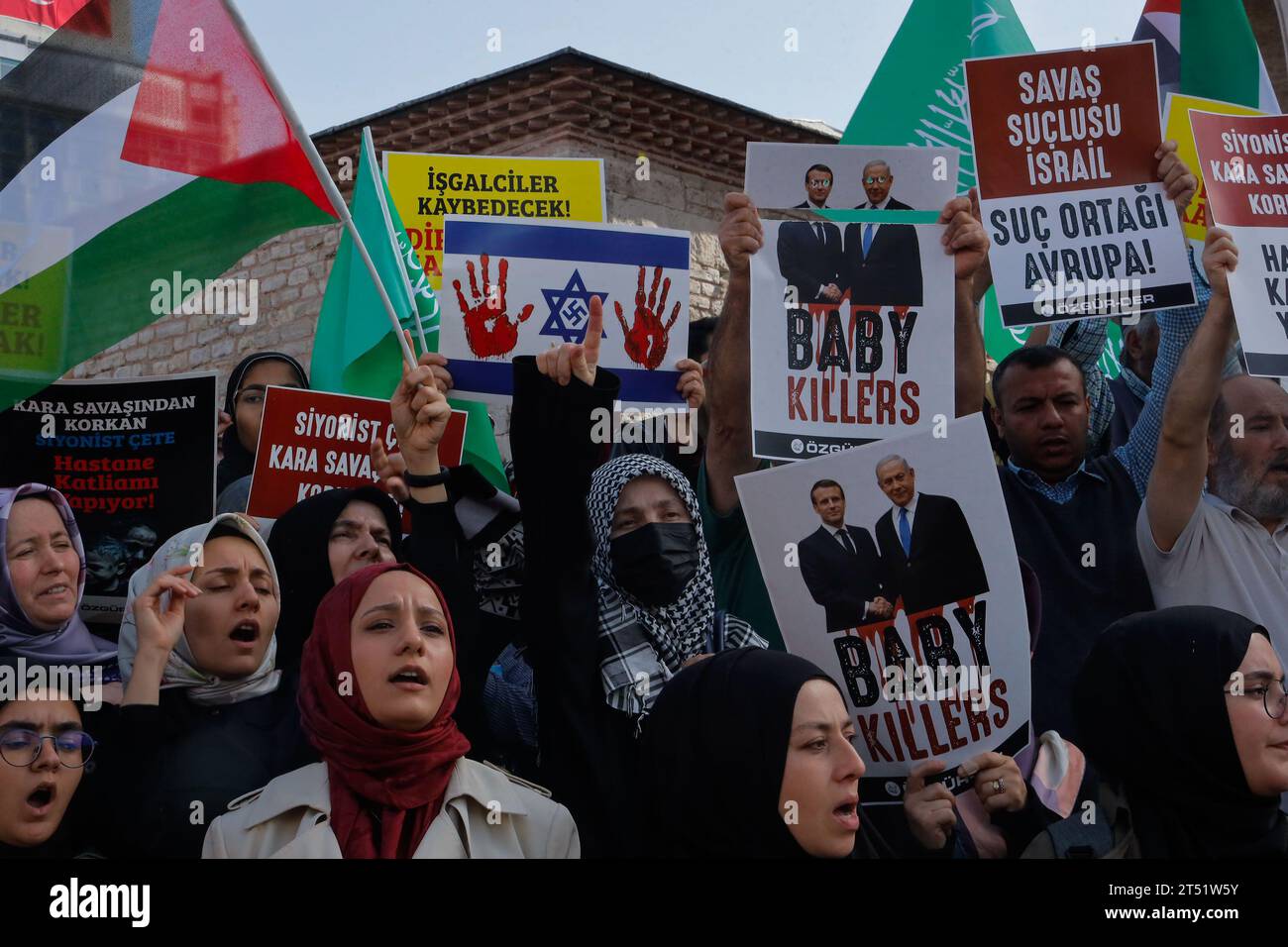 Istanbul, Turkey. 27th Oct, 2023. Protesters hold placards expressing ...