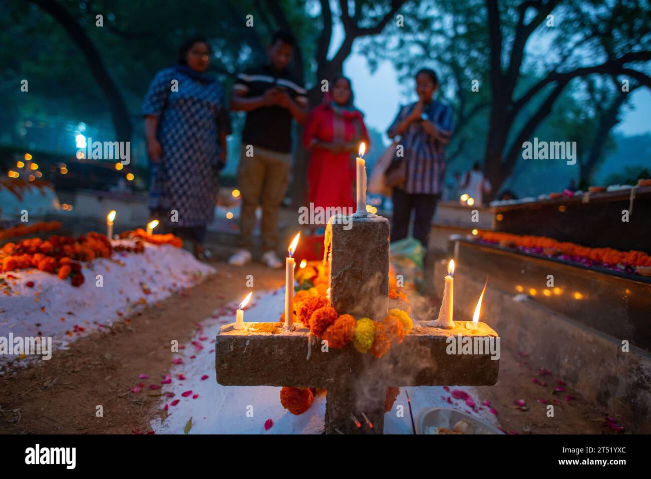 New Delhi, India. 02nd Nov, 2023. A family is seen lighting candles and ...
