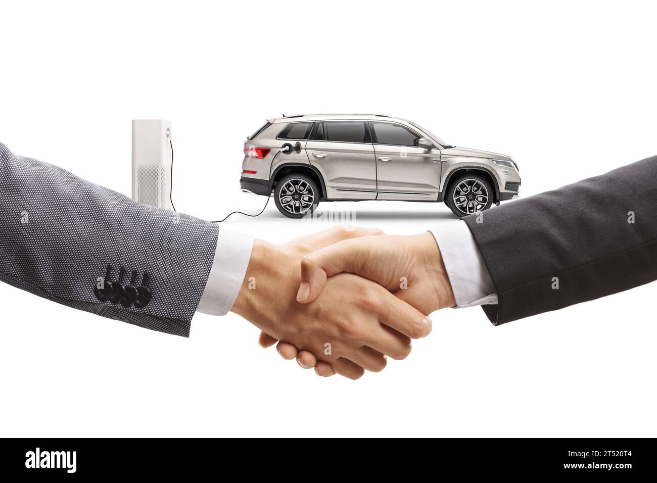 Men shaking hands in front of an electric SUV at a charging station ...