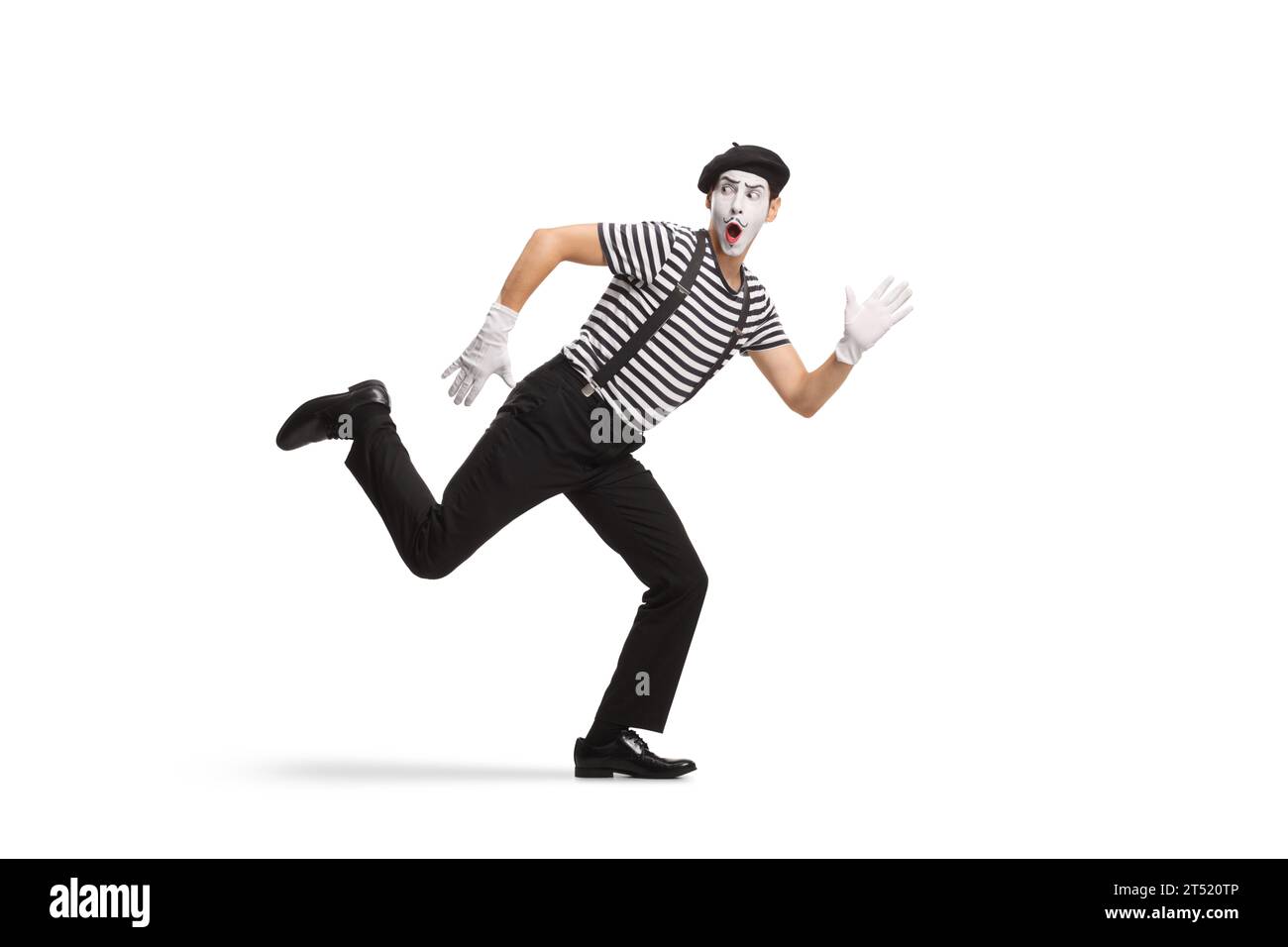 Full length shot of a scared mime running isolated on white background ...
