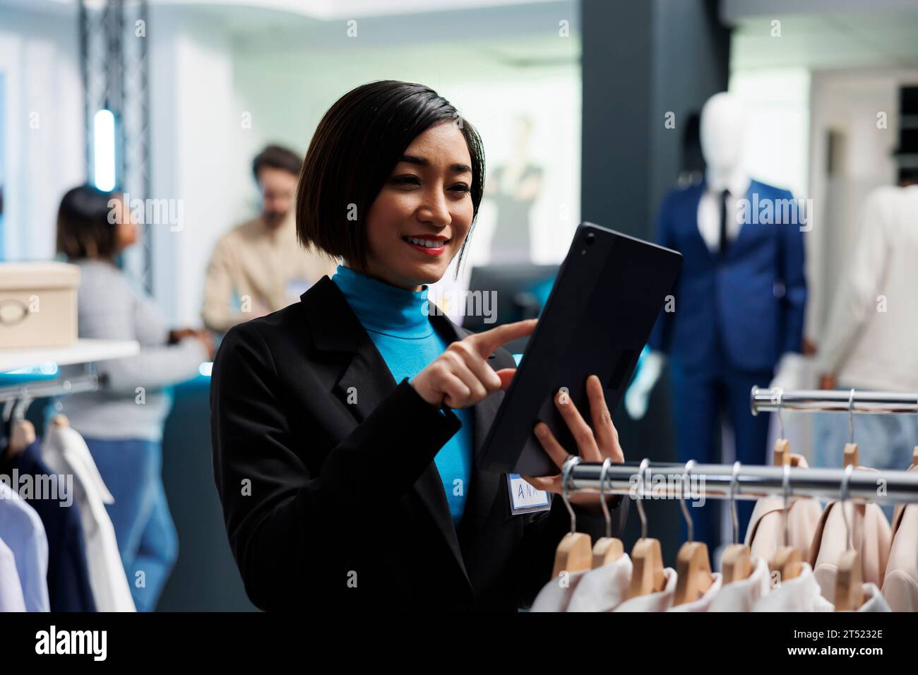 Woman holding tablet exploring stock hi-res stock photography and ...