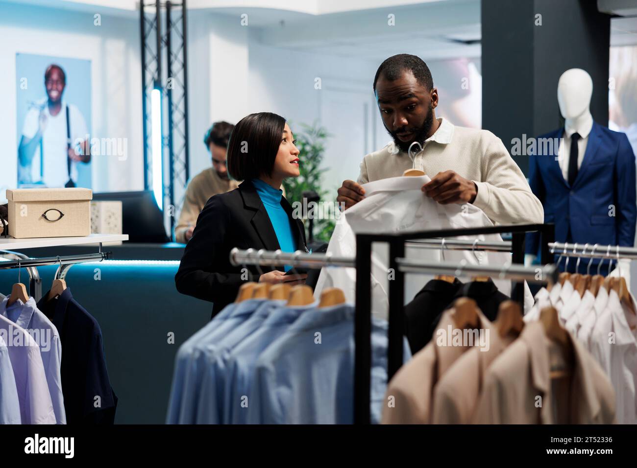Clothing store african american customer holding shirt on hanger ...