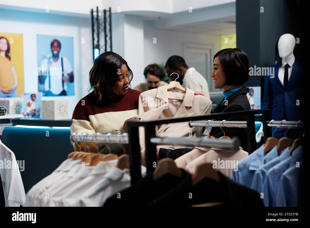 African american woman checking hanger hi-res stock photography and ...