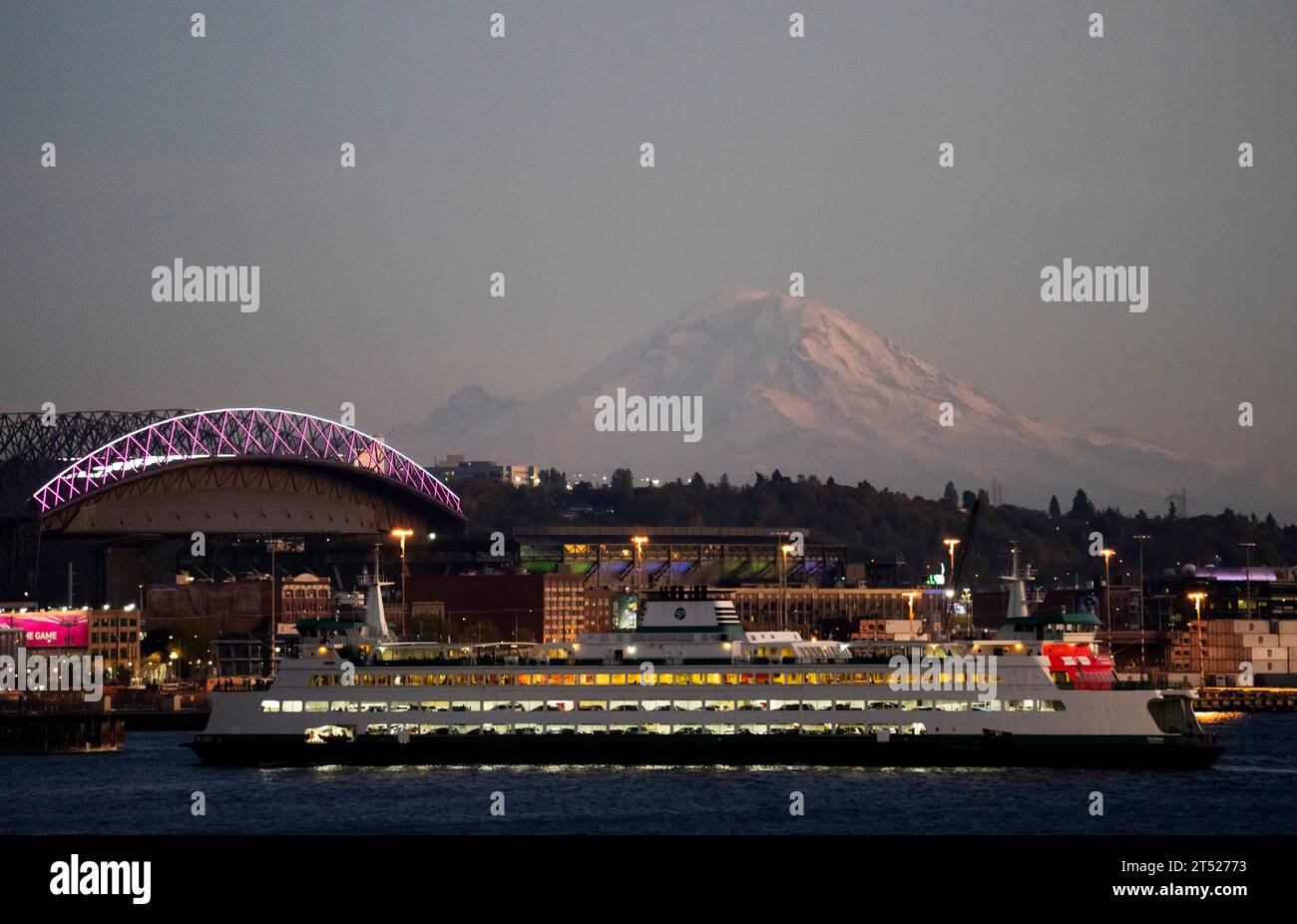 A Washington State ferry comes in to dock at the Seattle ferry terminal ...