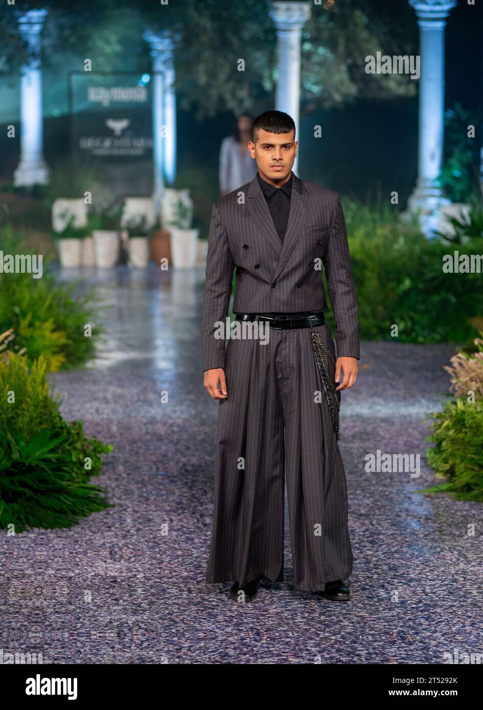 A model wearing designer Rajesh Pratap Singh's outfits while walking on ...