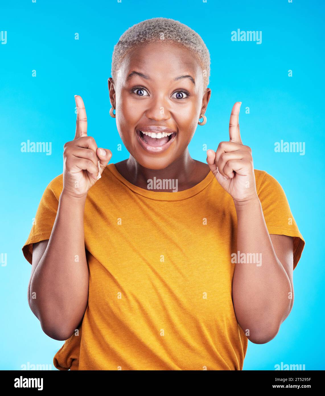 Excited portrait, pointing up and happy black woman gesture at eureka ...