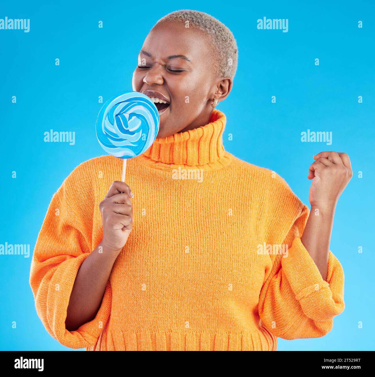 Singing, lollipop and a woman with candy in studio for sweets, rainbow ...