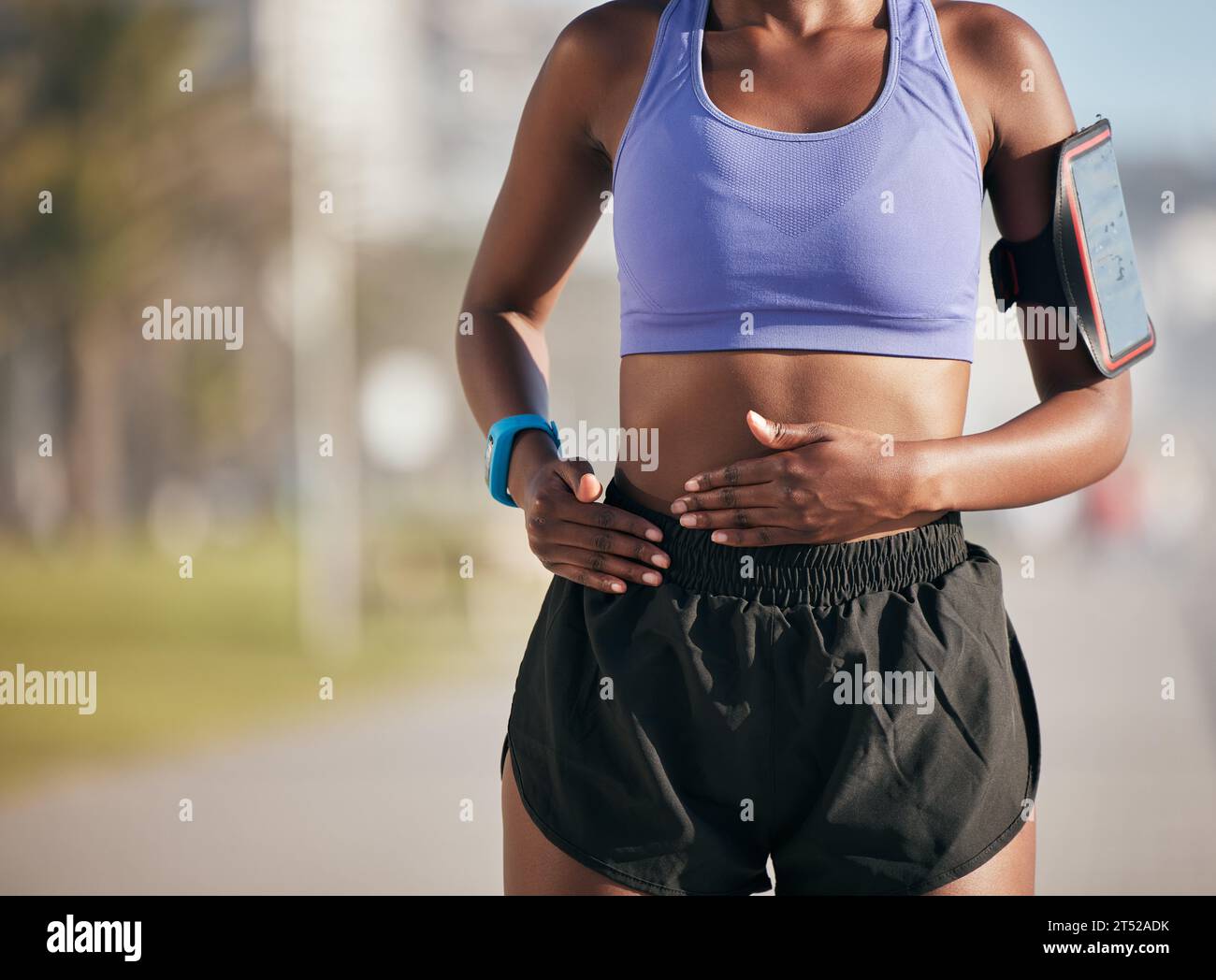 Pain, injury and athlete doing fitness running or exercise with stomach ...