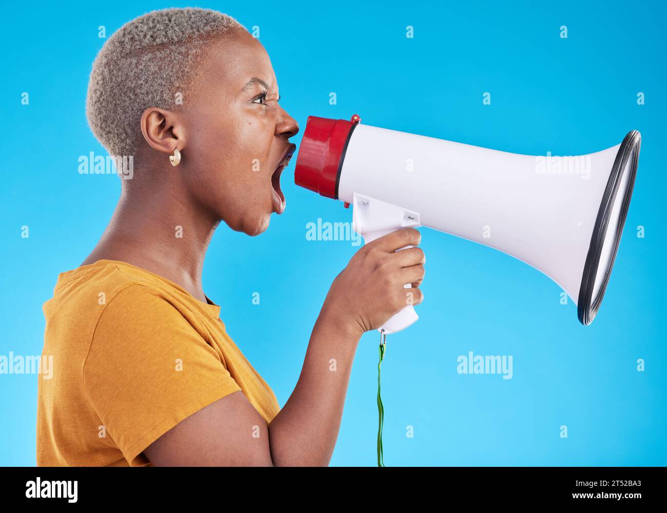 Black woman, megaphone and shout in studio, protest and profile with ...