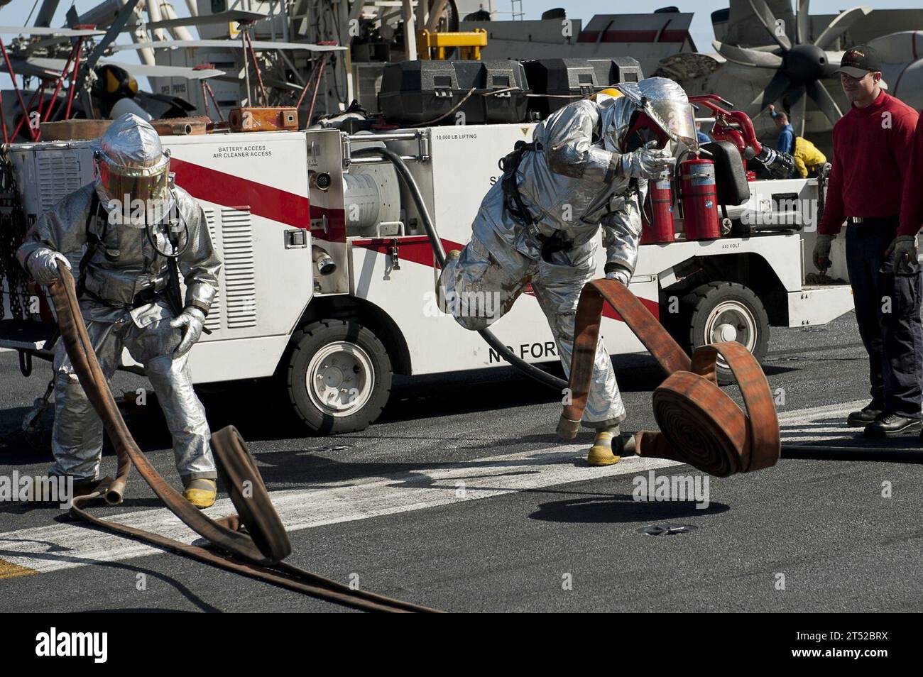 aircraft carrier, damage control Olympics, flight deck drills, Sailors ...
