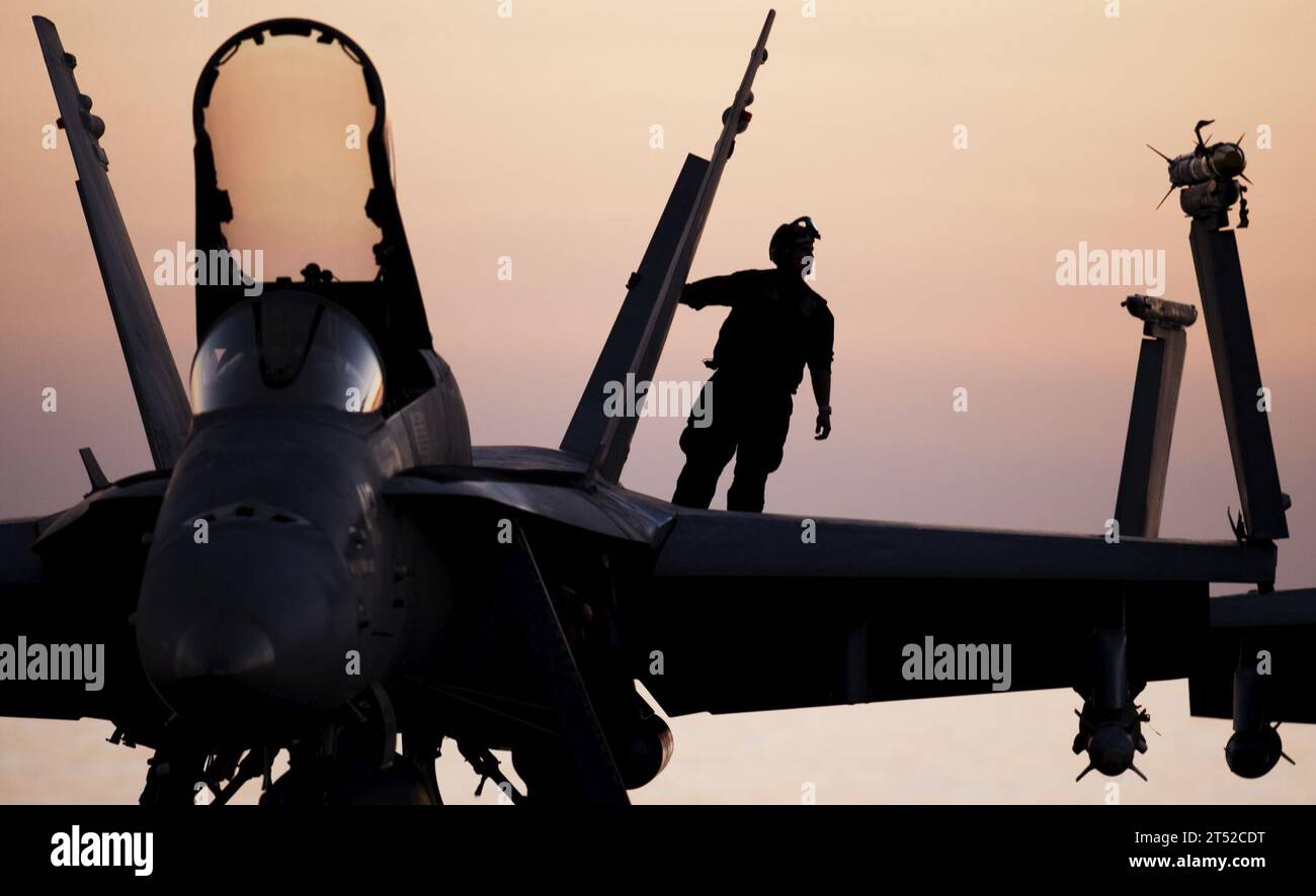 1102082055M-344 ARABIAN SEA (Feb. 8, 2011) A plane captain performs a ...
