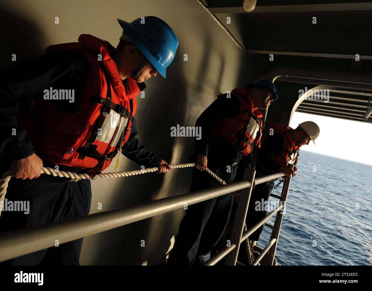 1101293374C-191 ATLANTIC OCEAN (Jan. 29, 2011) Sailors hold a line ...