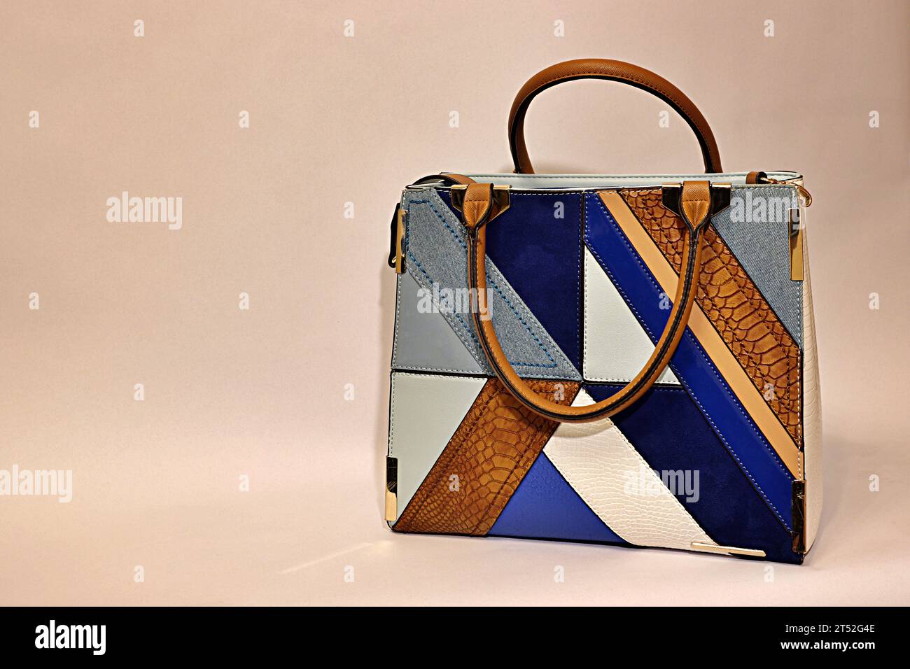 Women's handbag in blue, white, brown, light blue colors Stock Photo ...