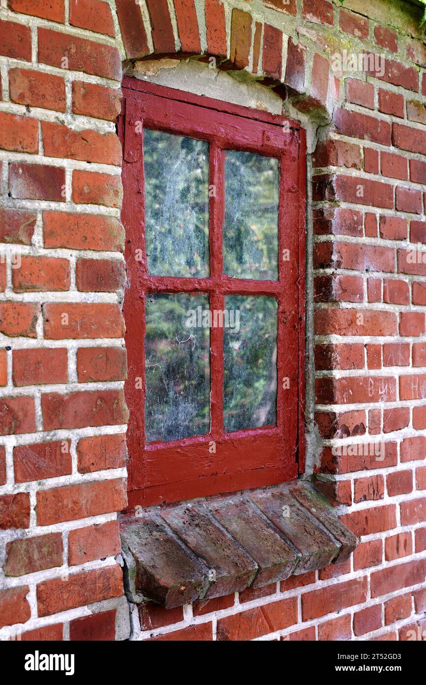 Old dirty window in a brick wall house or home. Ancient casement with ...