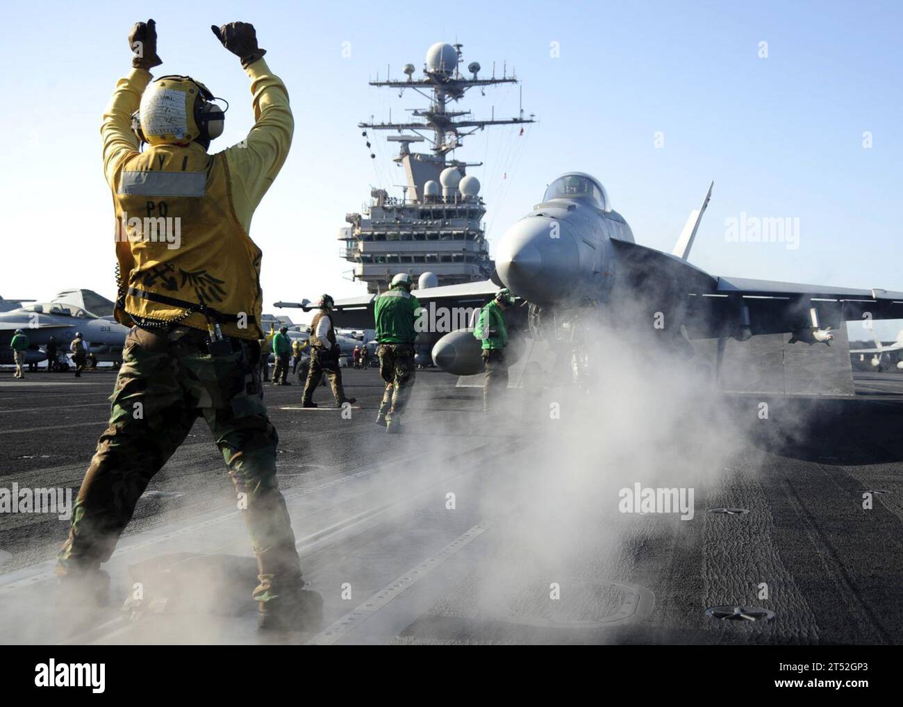 aircraft, Carrier, flight deck, yellow shirt Stock Photo - Alamy