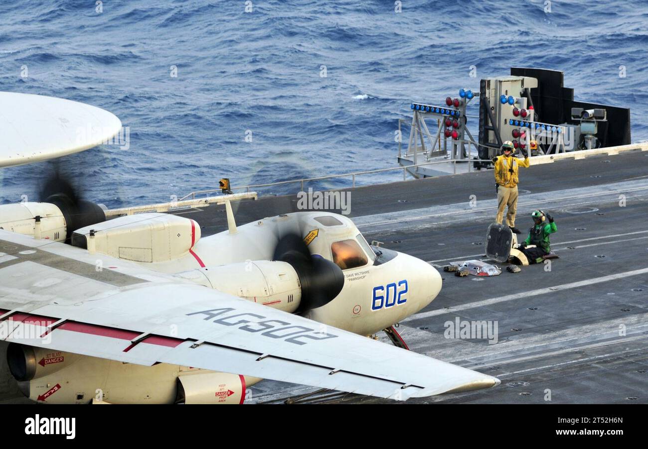 1006233595W-004 NORTH ARABIAN SEA (June 23, 2010) Sailors signal the ...