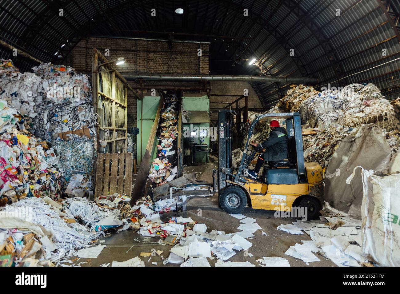 Sorting, loading and packing of wastepaper in recycling factory Stock ...