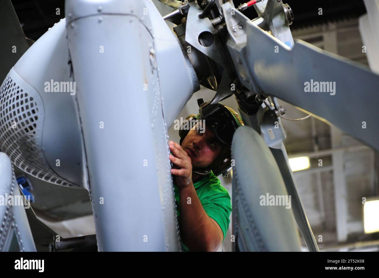 Airman Josh Rowell works on the tail gear of an HH-60H Seahawk assigned ...