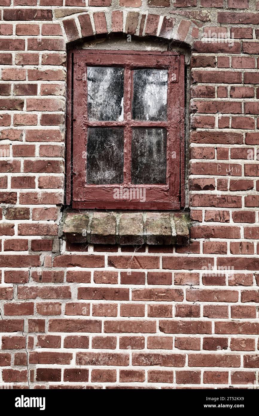 Old dirty window in a red brick house or home. Ancient casement with ...