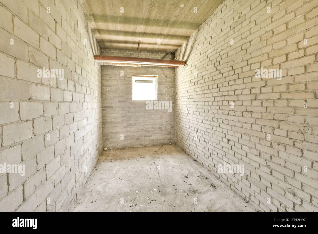 the inside of a building with brick walls and concrete flooring in ...
