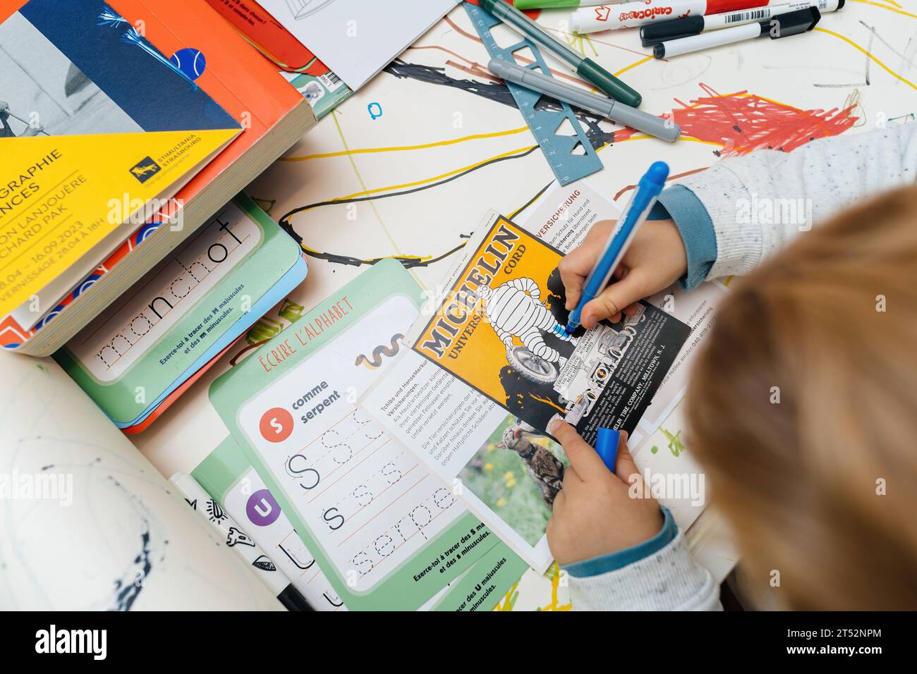 Paris, France - Oct 25, 2023: From above, a curious toddler boy ...