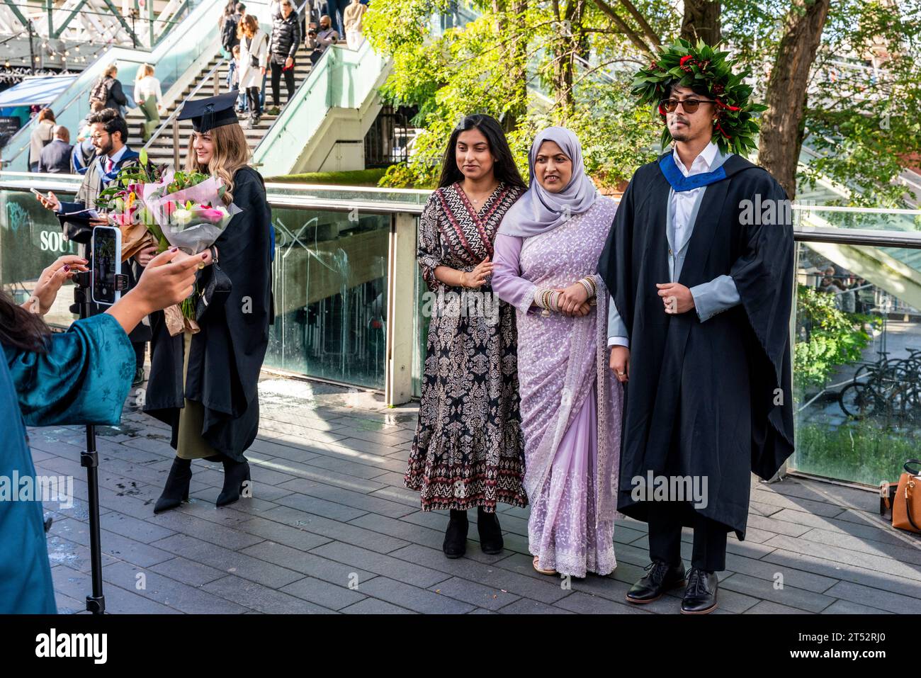 Degree Students pose with their Families At Their Graduation Ceremony ...