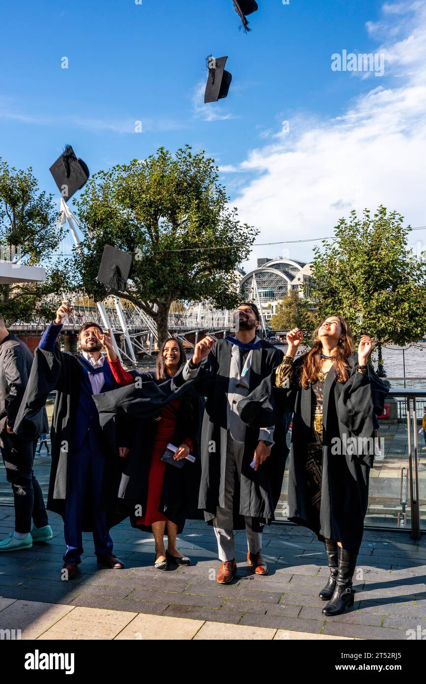 Degree Students Throw Their Mortar Board Hats In The Air At Their ...