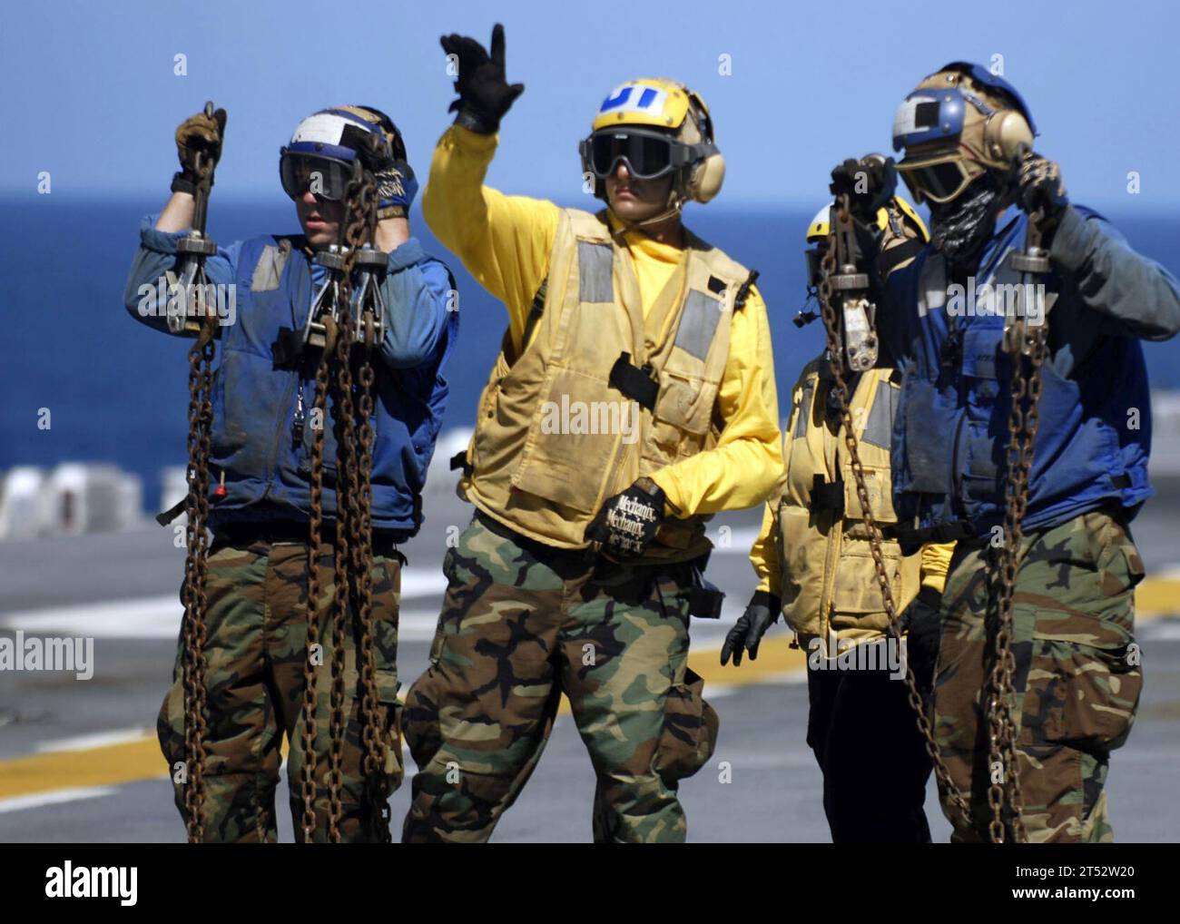 0906259950J-185 CORAL SEA (June 25, 2009) Sailors aboard the amphibious ...