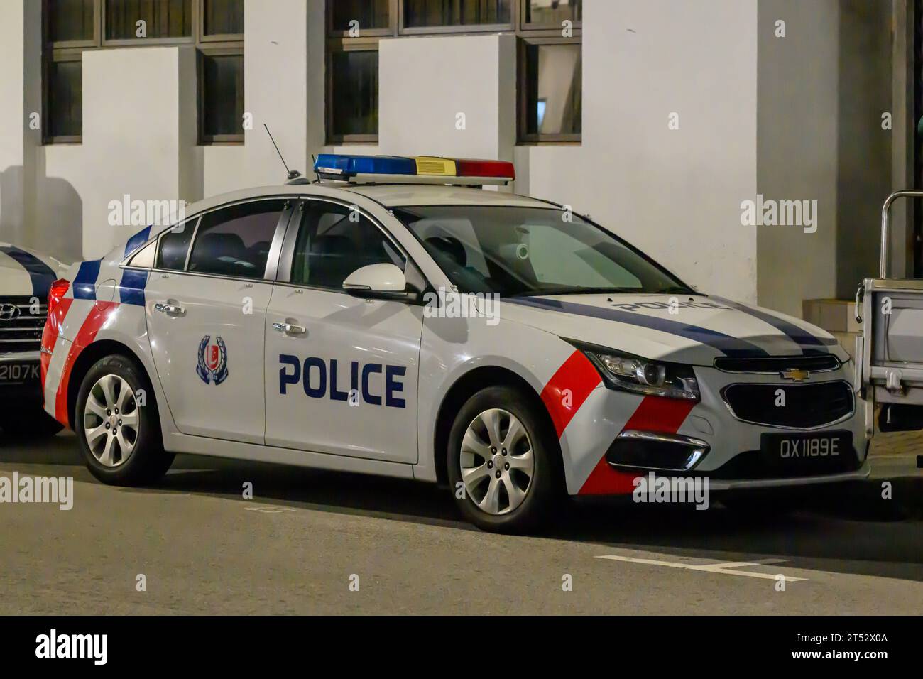 Parked Singapore Police car at night Stock Photo - Alamy