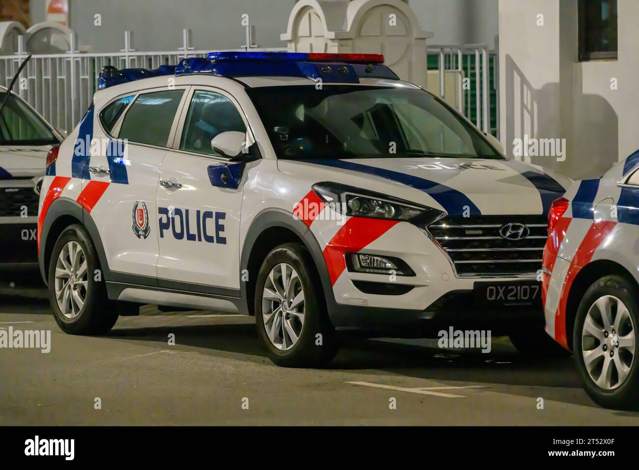 Parked Singapore Police car at night Stock Photo - Alamy
