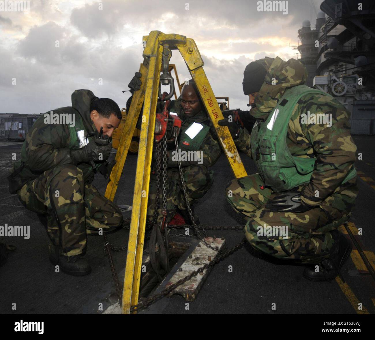 1012137103C-015 PACIFIC OCEAN (Dec. 13, 2010) Sailors use an industrial ...
