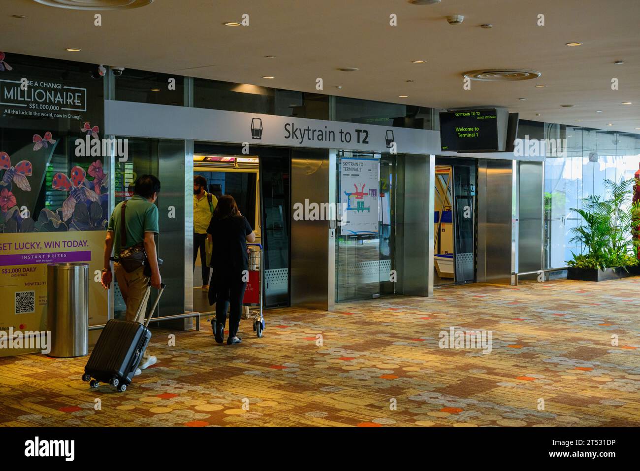Boarding the Skytrain at Singapore Changi Airport Stock Photo - Alamy