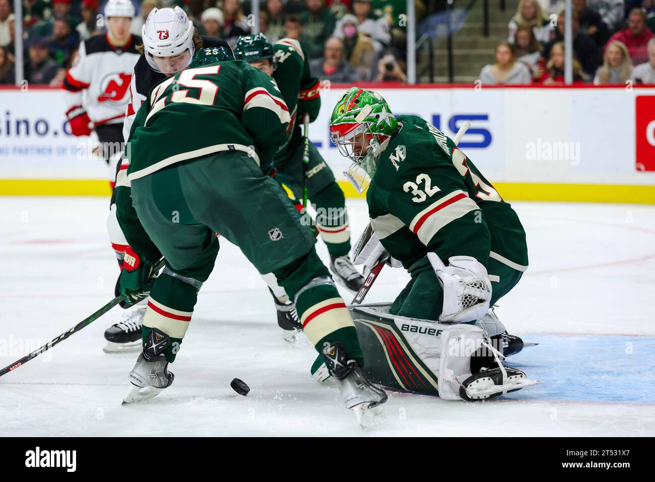 Minnesota Wild goaltender Filip Gustavsson, right, makes a save on a ...