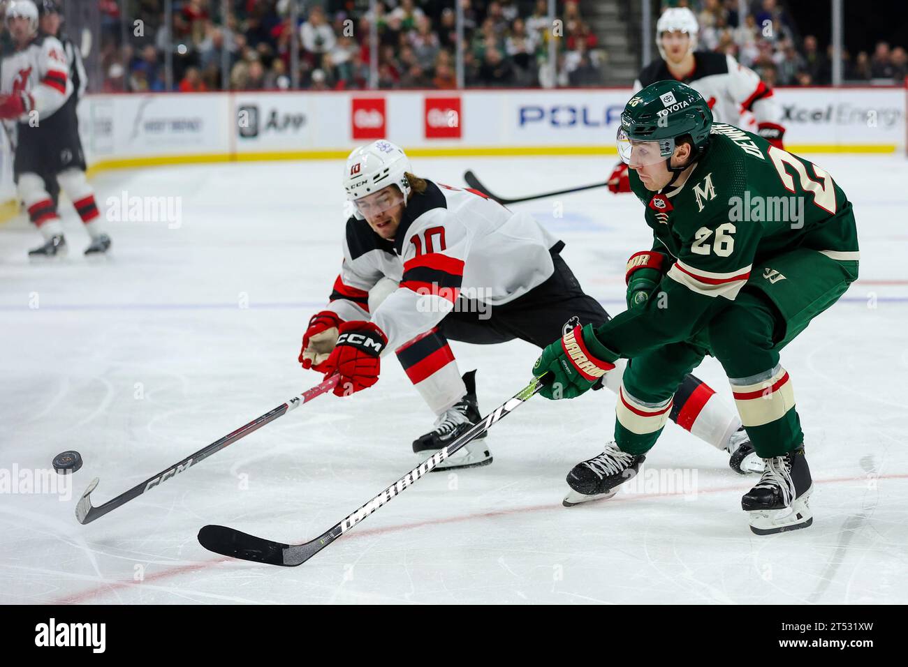 Minnesota Wild center Connor Dewar, right, and New Jersey Devils right ...