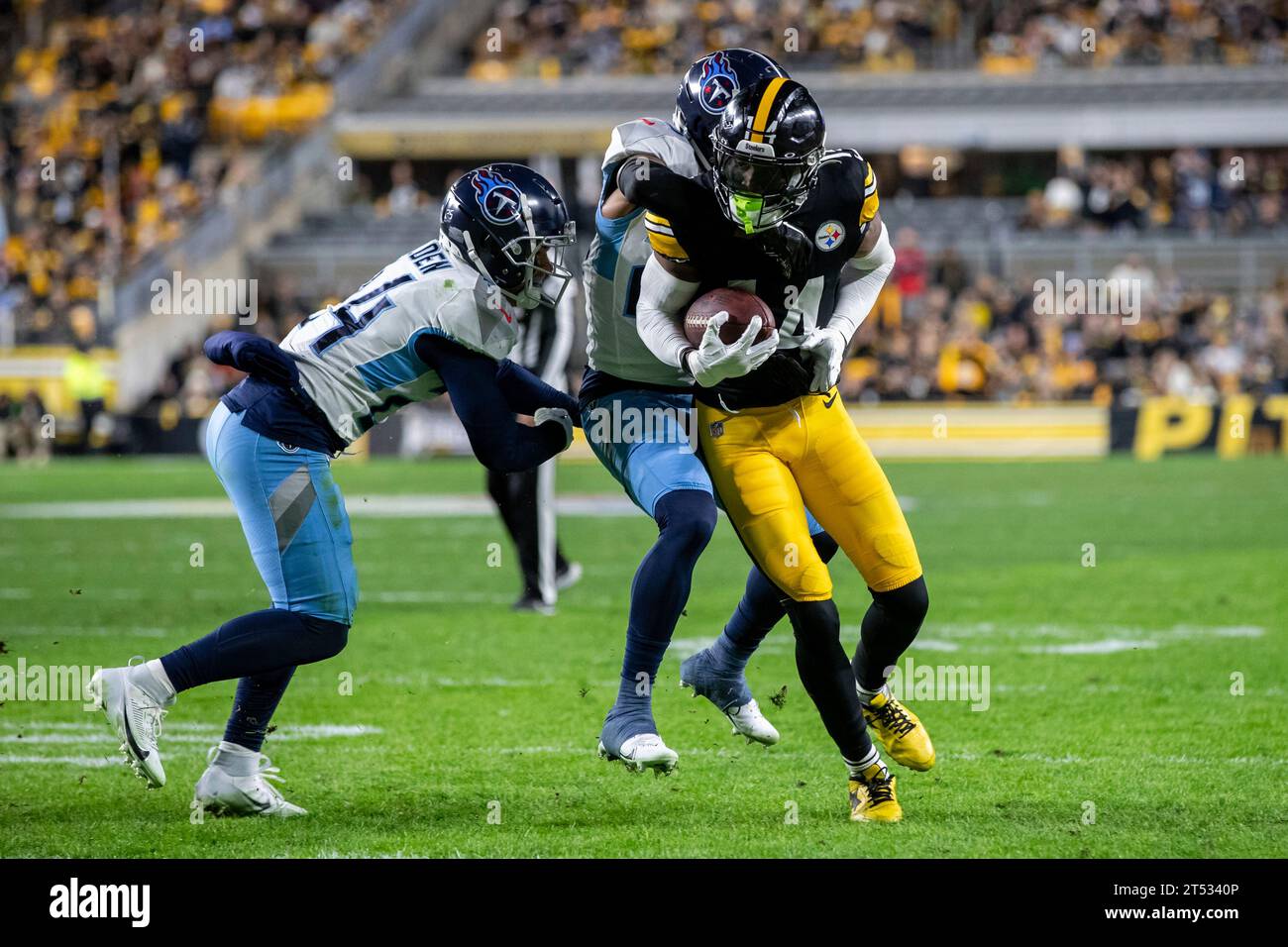 Pittsburgh Steelers wide receiver George Pickens (14) is tackled by ...