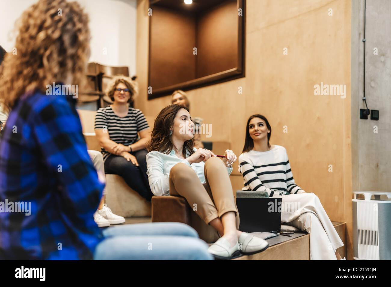 Inter-generational business group discussing in meeting at the office ...