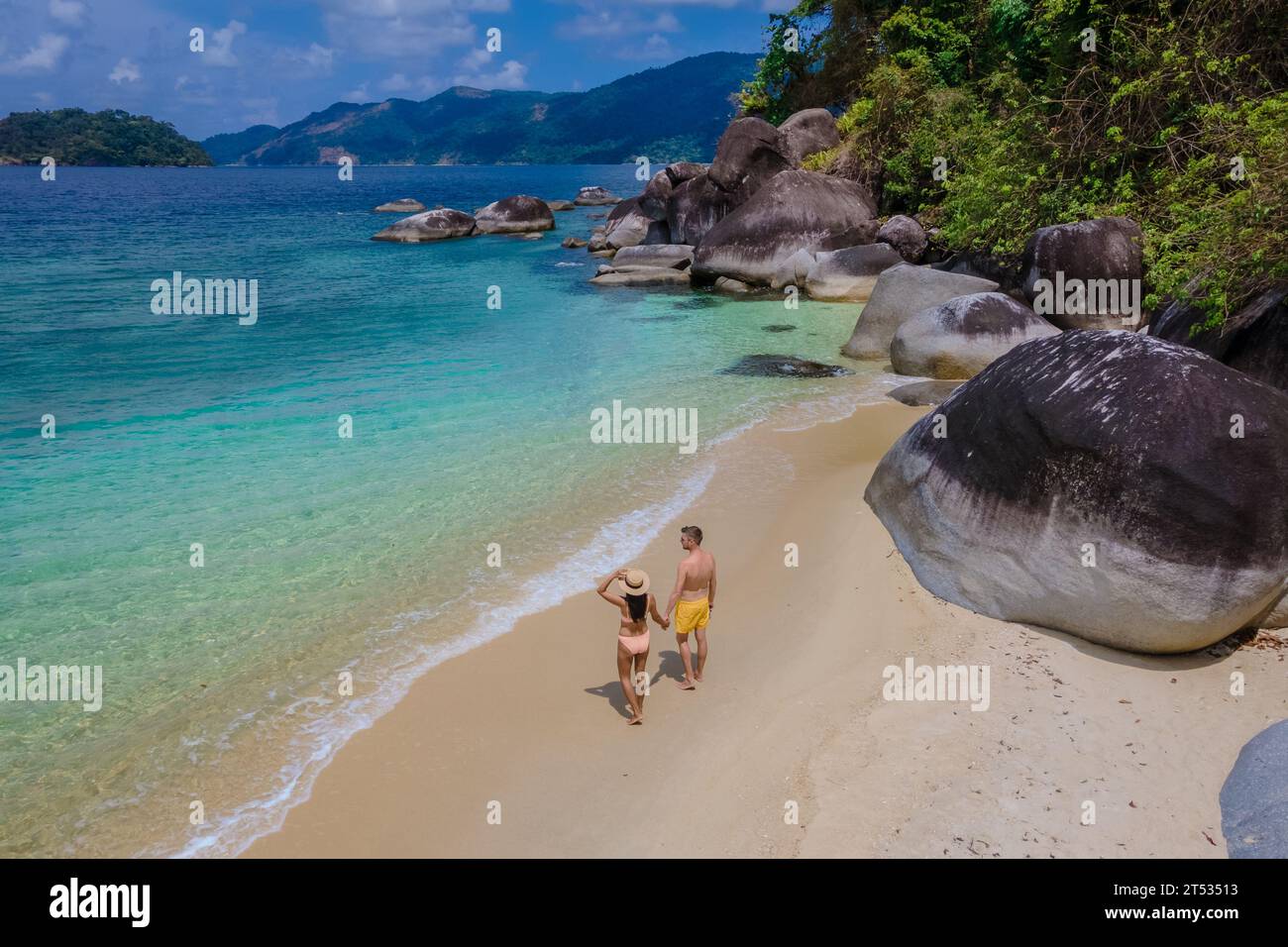 couple on the beach of Ko Adang Island in front of Koh Lipe Island ...