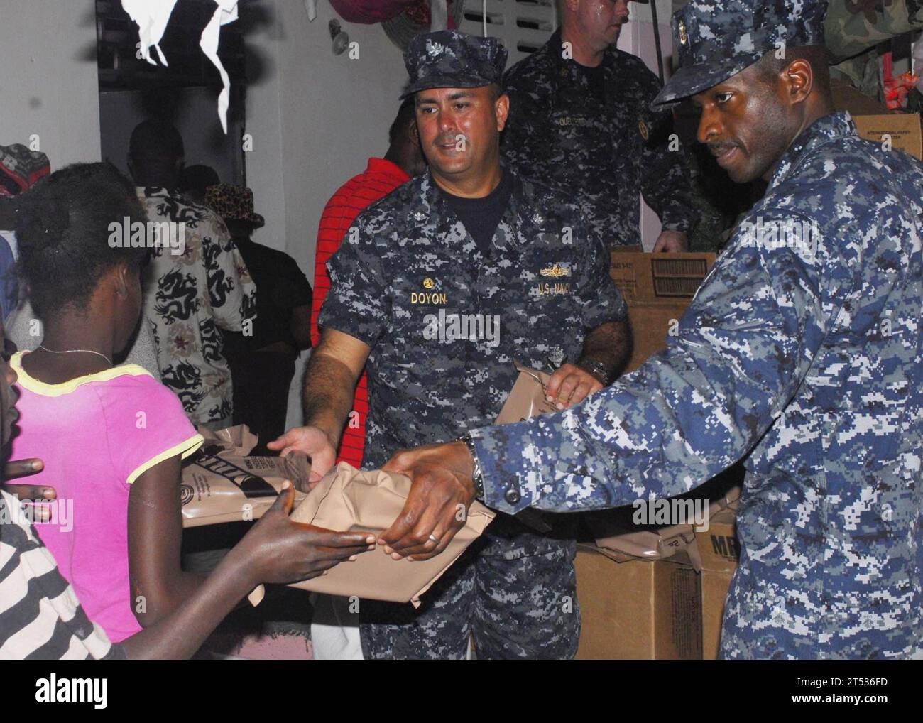 1001195244H-040 BONEL, Haiti (Jan. 19, 2010) Cmdr. George Doyon, left ...