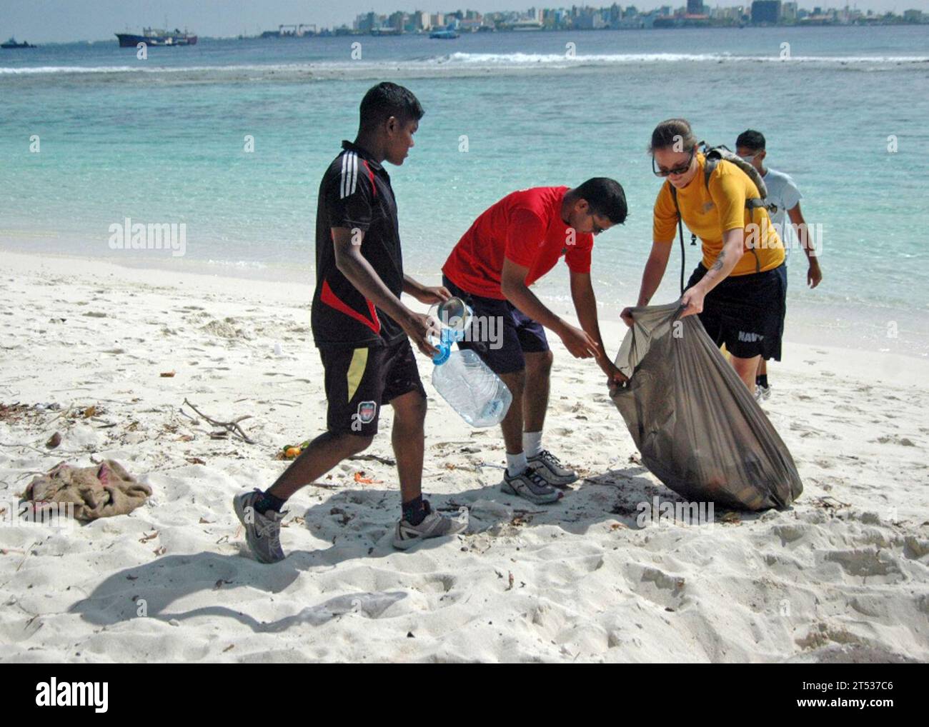 Beach Clean Up, community service projects, female, Maldives coast ...