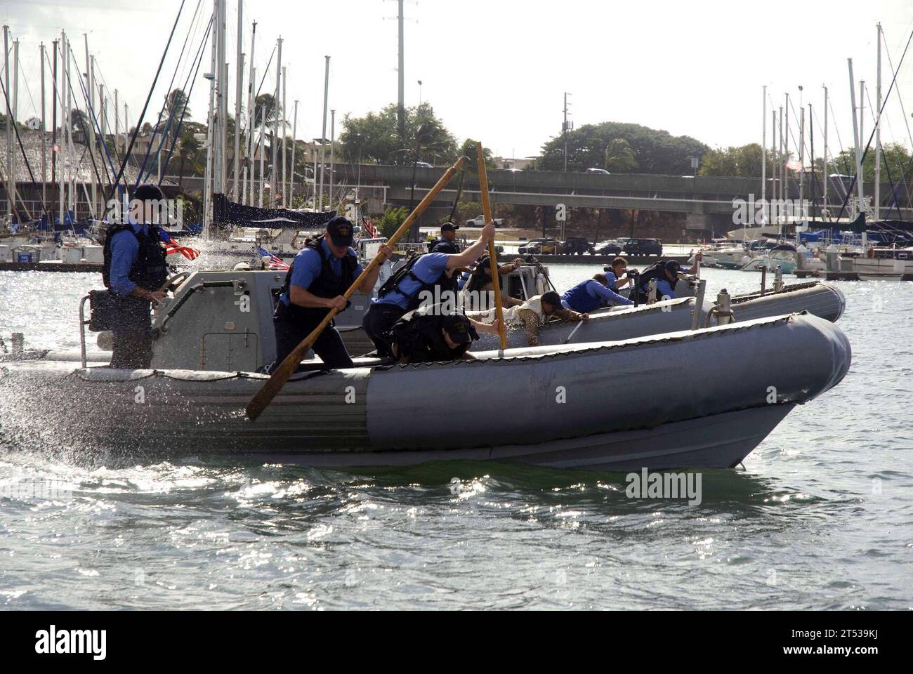 0710316674H-003 PEARL HARBOR, Hawaii (Oct. 31, 2007) - Sailors paddle ...