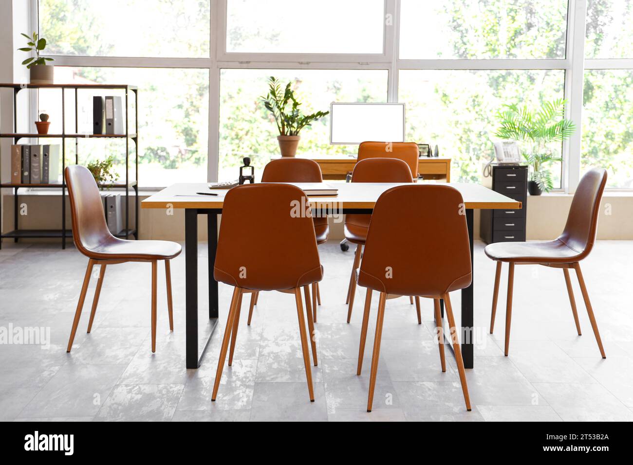 Interior of modern office with table and window Stock Photo - Alamy