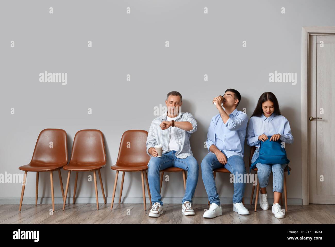People waiting for their turn in room Stock Photo - Alamy