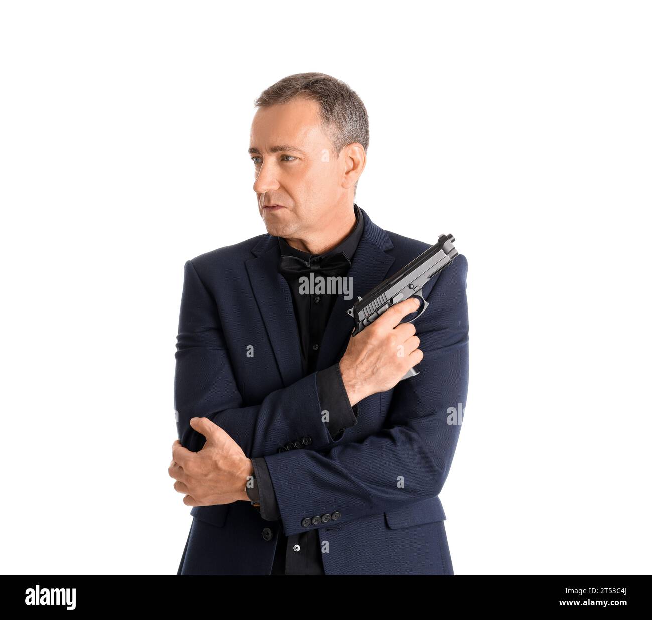 Mature actor with gun on white background Stock Photo - Alamy