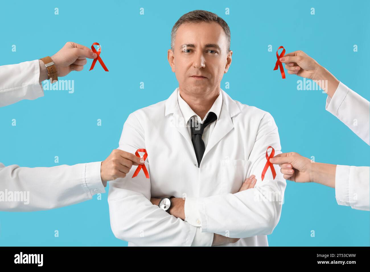 Mature male doctor and hands with red ribbons on blue background. World ...